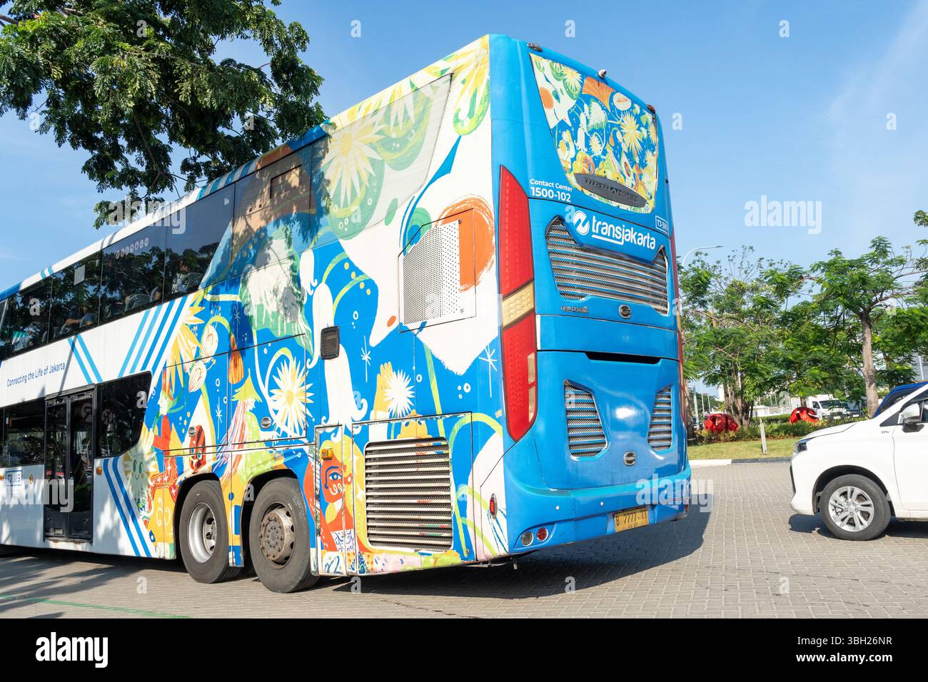 Jakarta, Indonesia - February 9, 2025: Colorful bus with a blue and ...