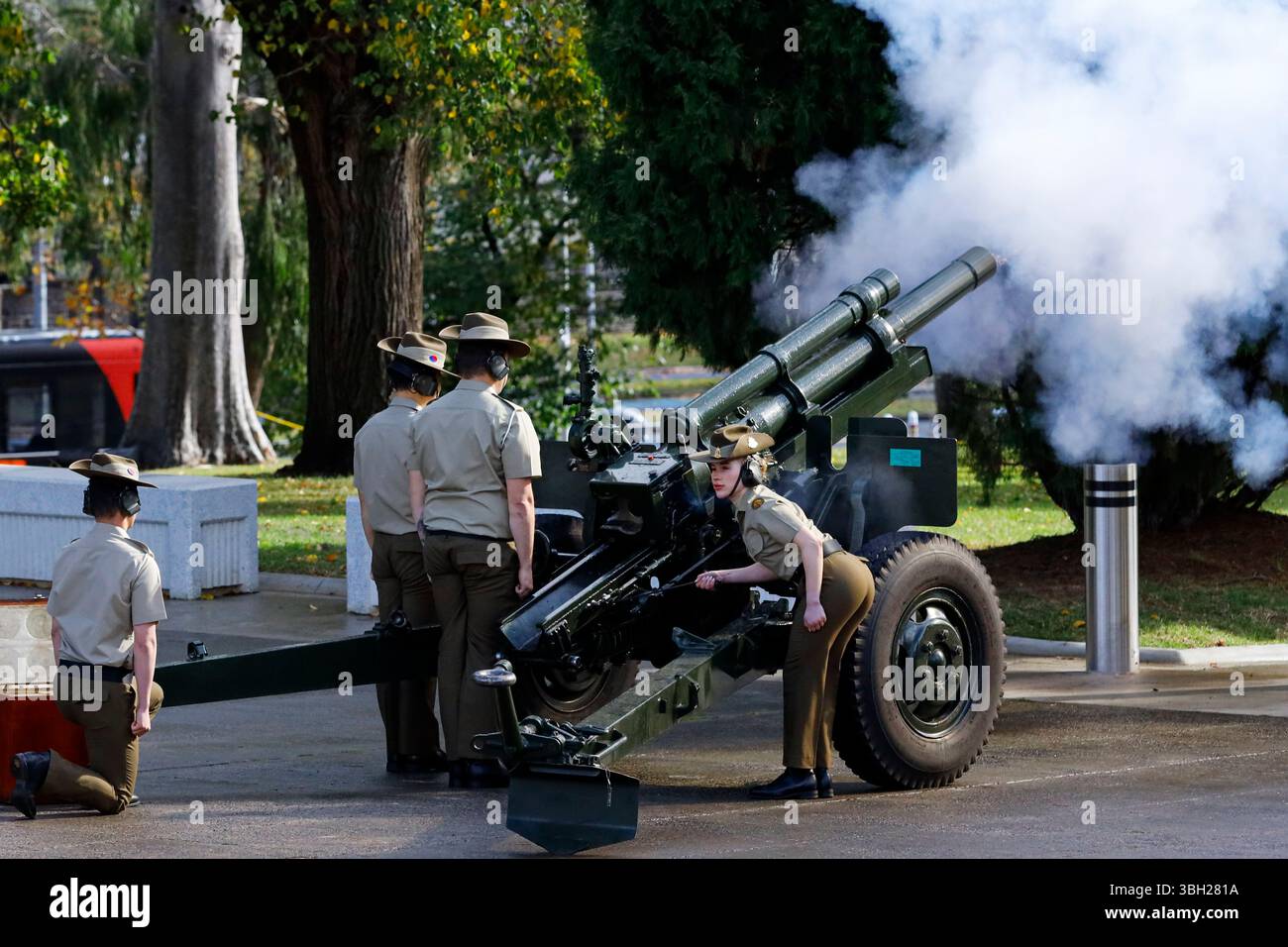 Army Reservists fire one of the 21 ceremonial rounds during the ...