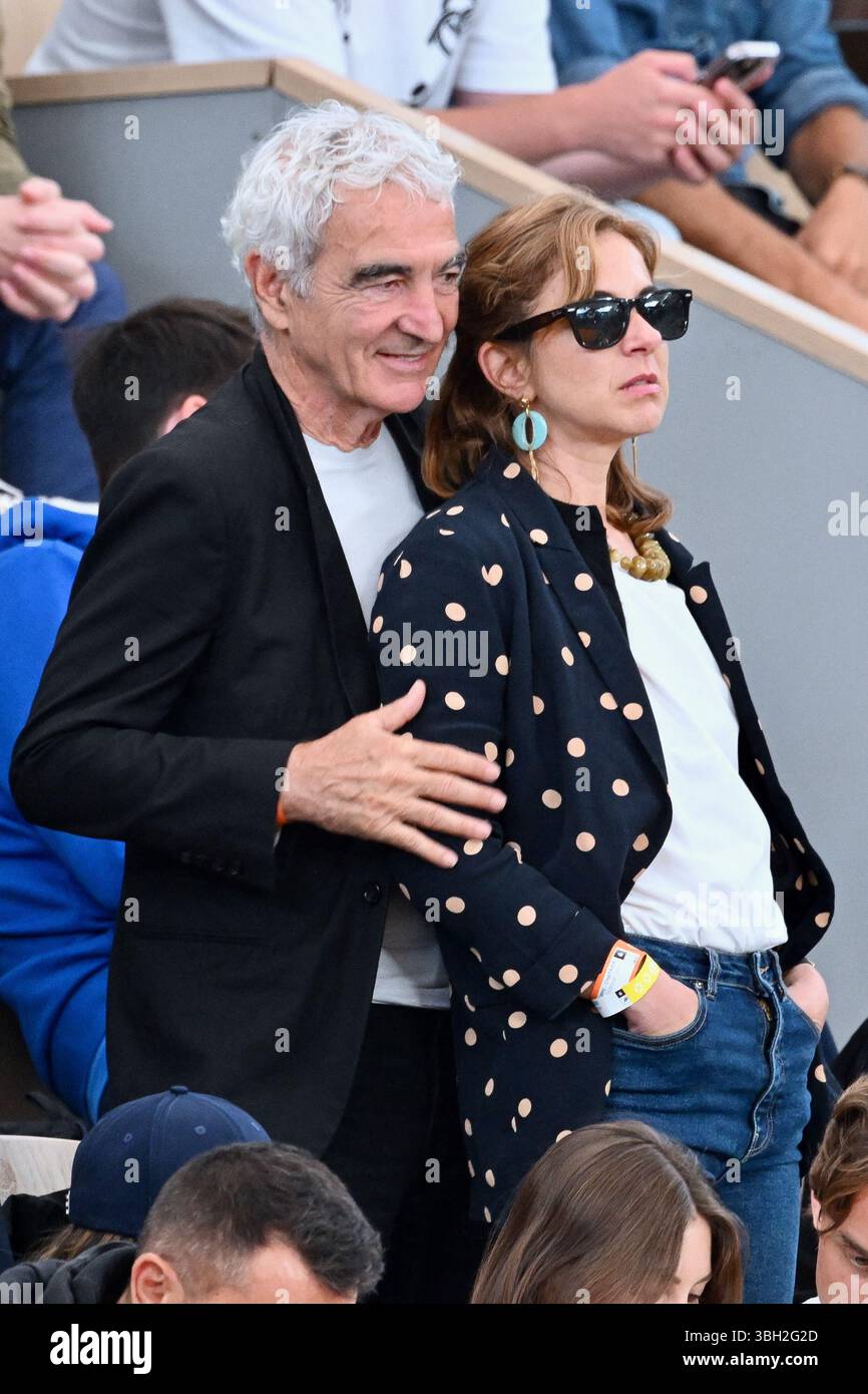 Raymond Domenech et sa nouvelle compagne seen in the stands during ...