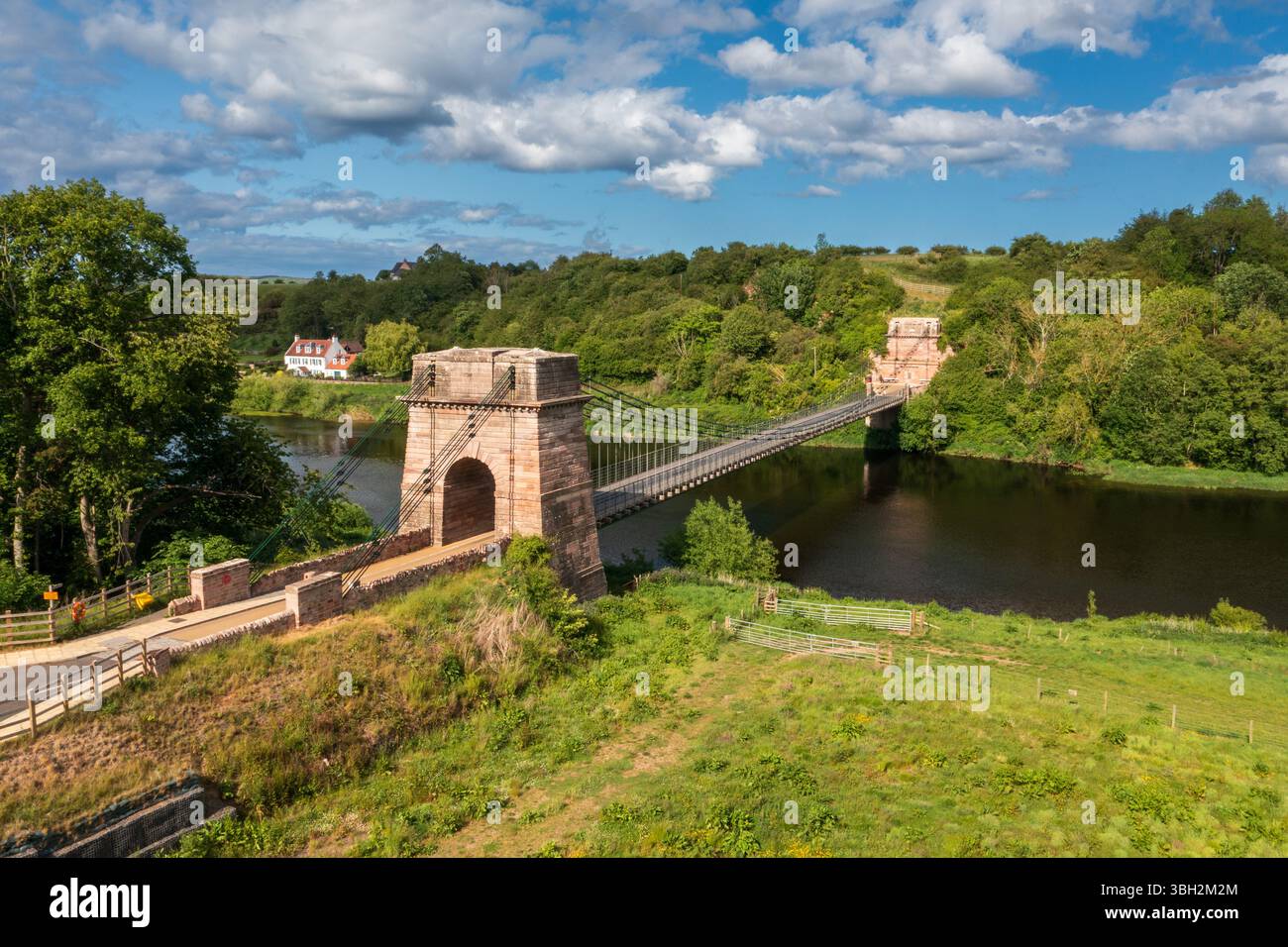 Summer and the newly restored Union Chain Bridge spans the River Tweed ...