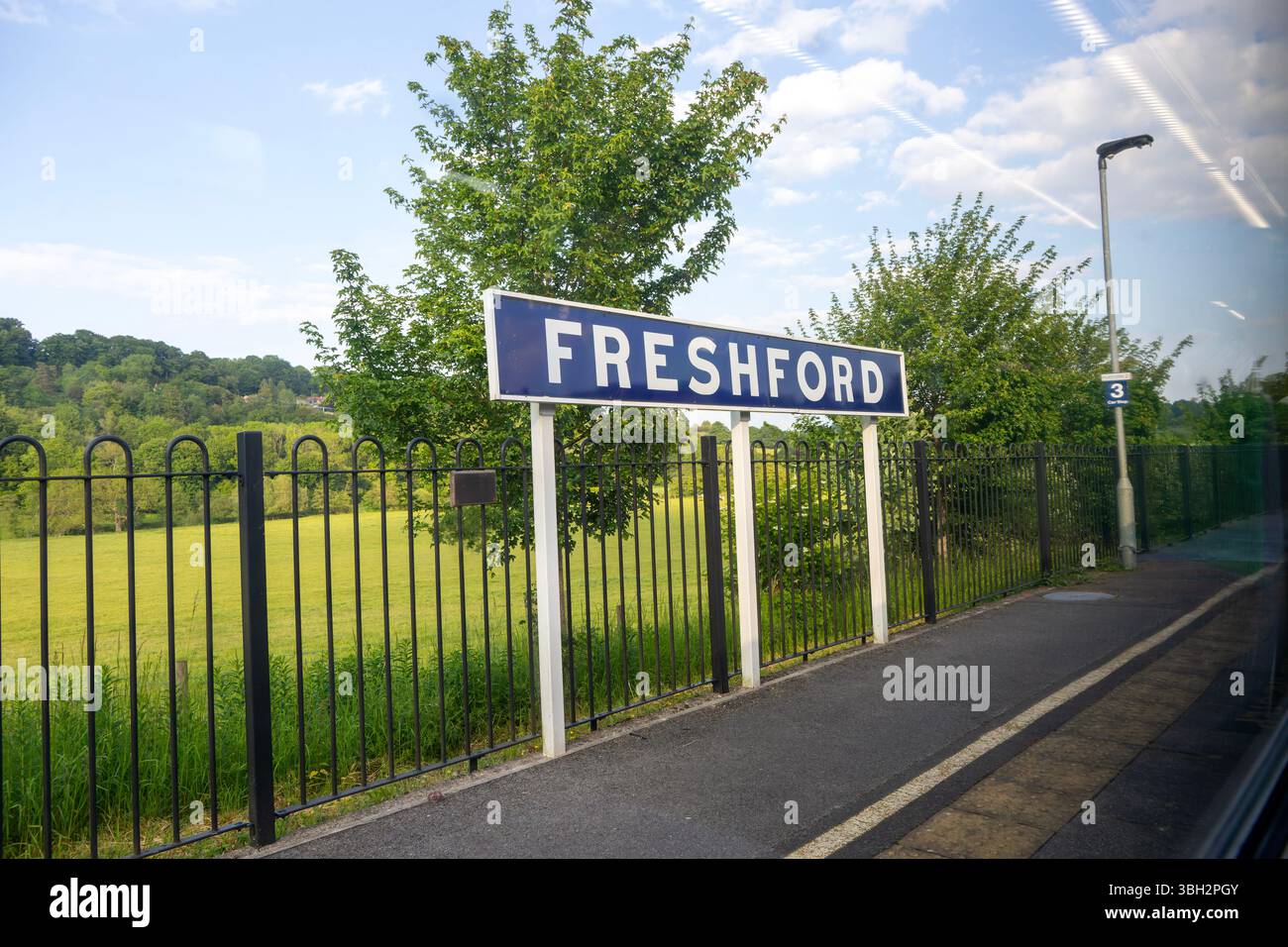 Freshford railway station platform sign taken through train window ...