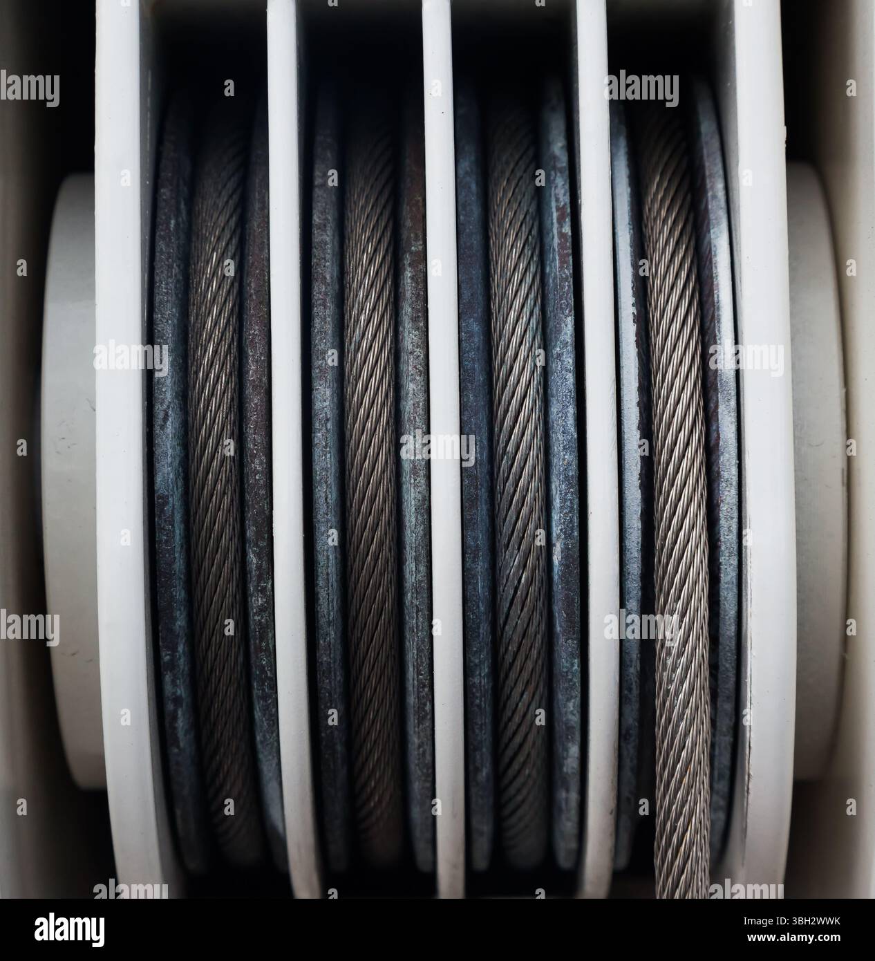 Cargo rollers with a steel cable wound on them, on a yacht crane, close ...
