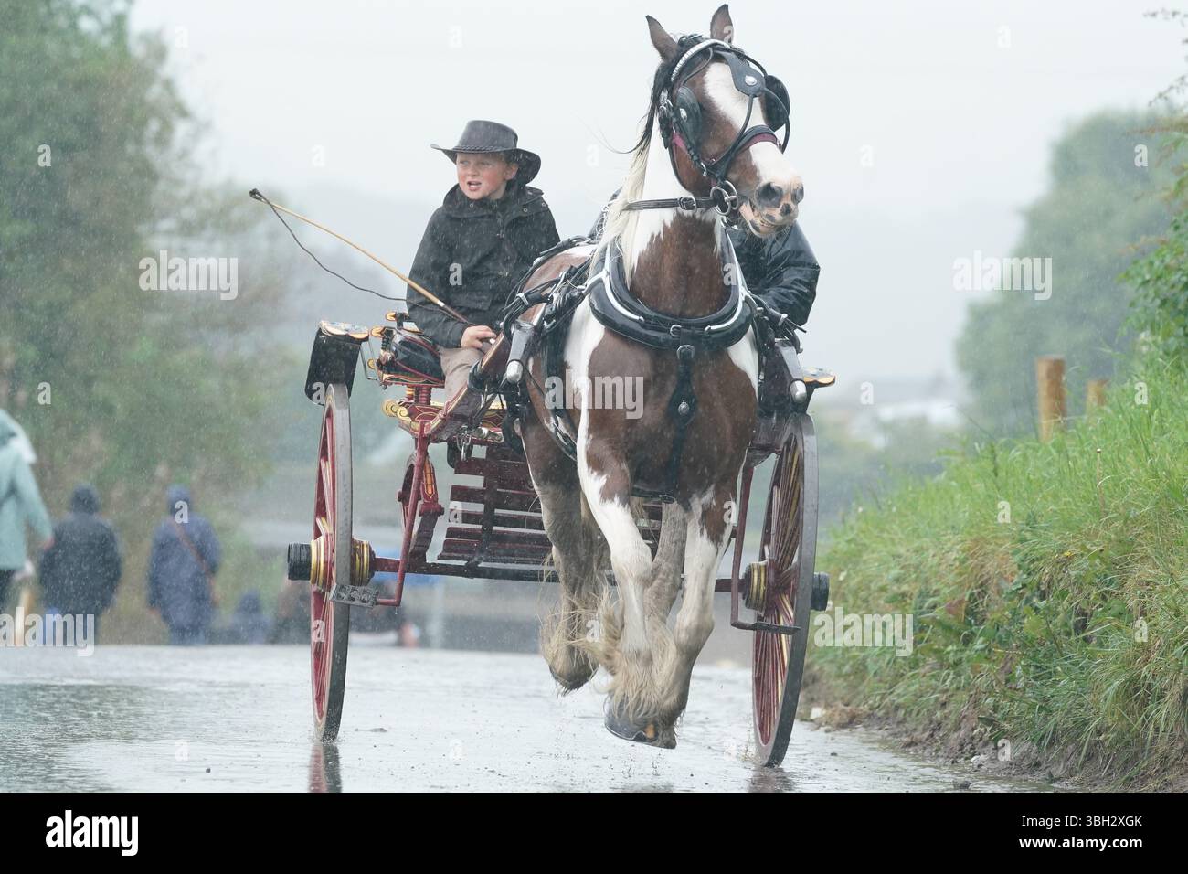 People in a horse drawn carriage during the Appleby Horse Fair, the ...