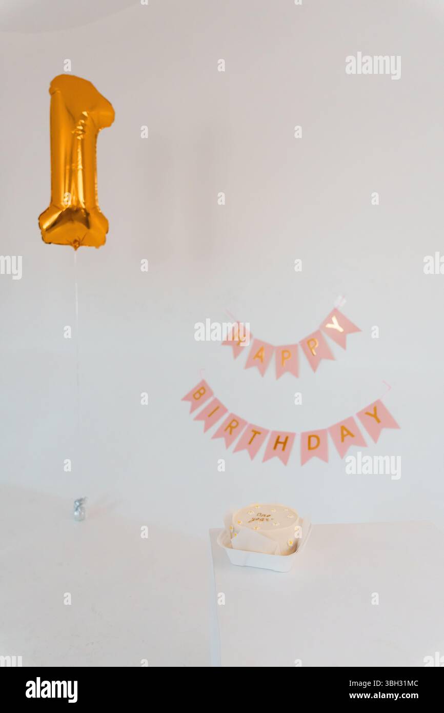 Festive First Birthday Celebration with Cake and Balloon Stock Photo ...