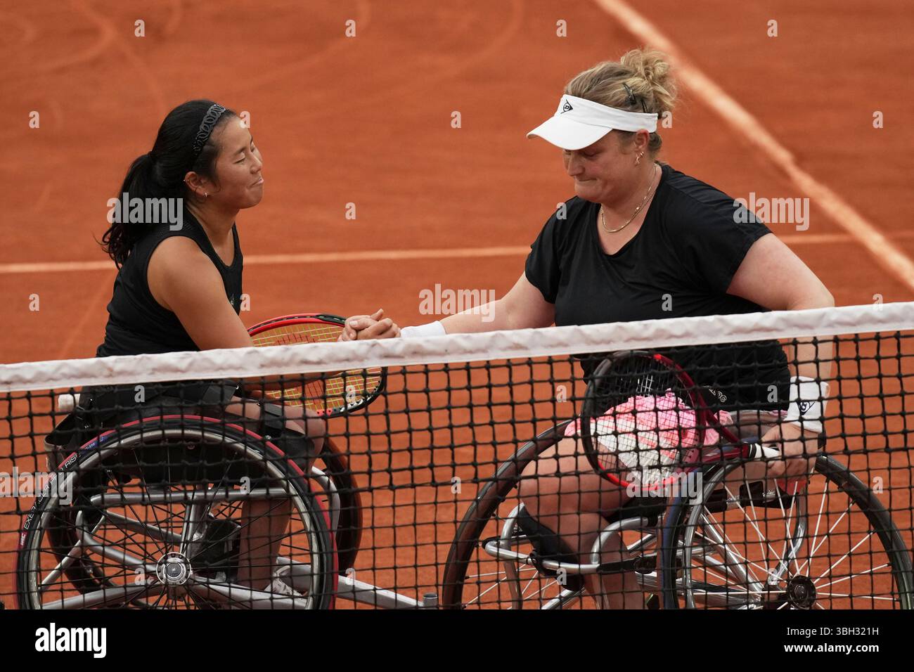 Winner Japan's Yui Kamiji, left, and Netherlands' Aniek Van Koot shake ...