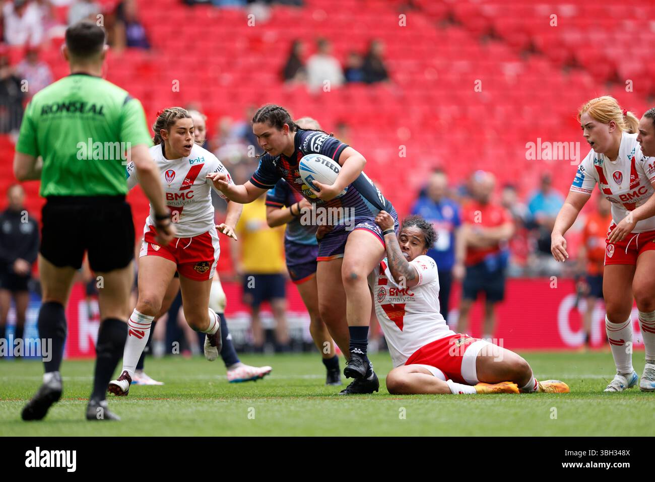 St Helens' Naomi Williams scores a try during the Women's Challenge Cup ...