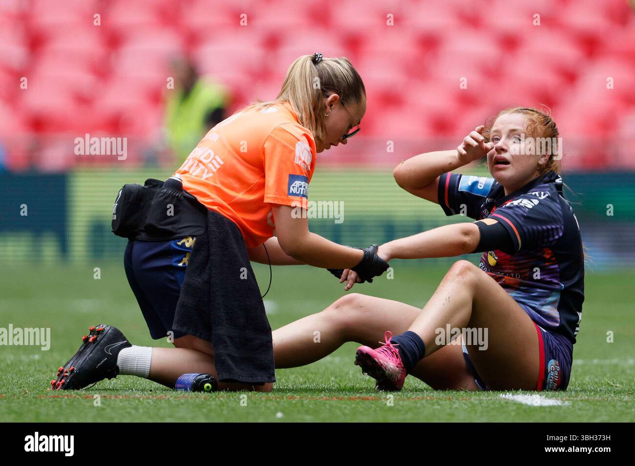 Wigan Warriors' Grace Banks receives treatment for an injury during the ...