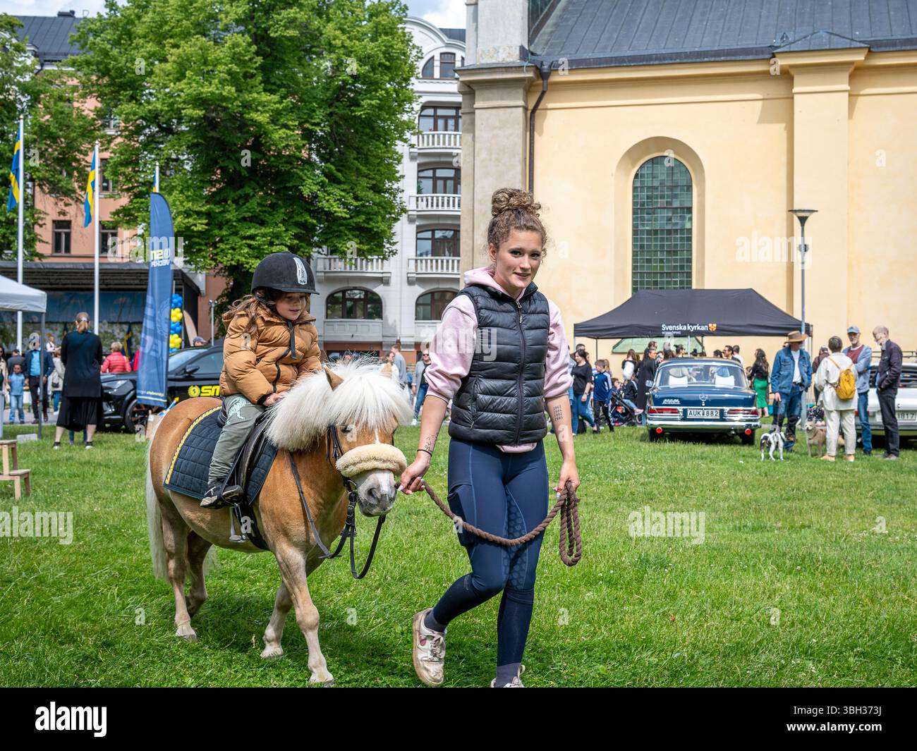Pony ride offered during Swedish National day celebration at the Olai ...