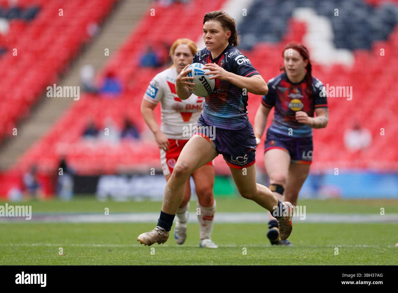 Wigan Warriors' Molly Jones in action with the ball during the Women's Challenge Cup Final at ...