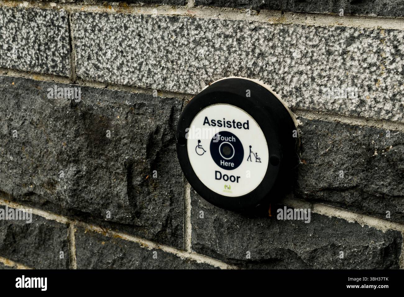 Round ‘Touch To Open’ sensor placed on outdoor wall for automatic door ...