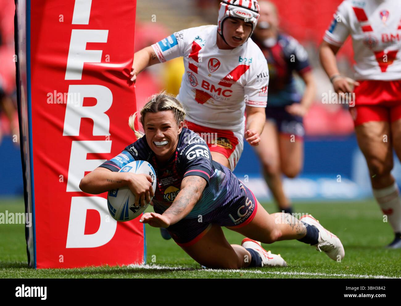 Wigan Warriors' Emily Veivers scores a try during the Women's Challenge ...