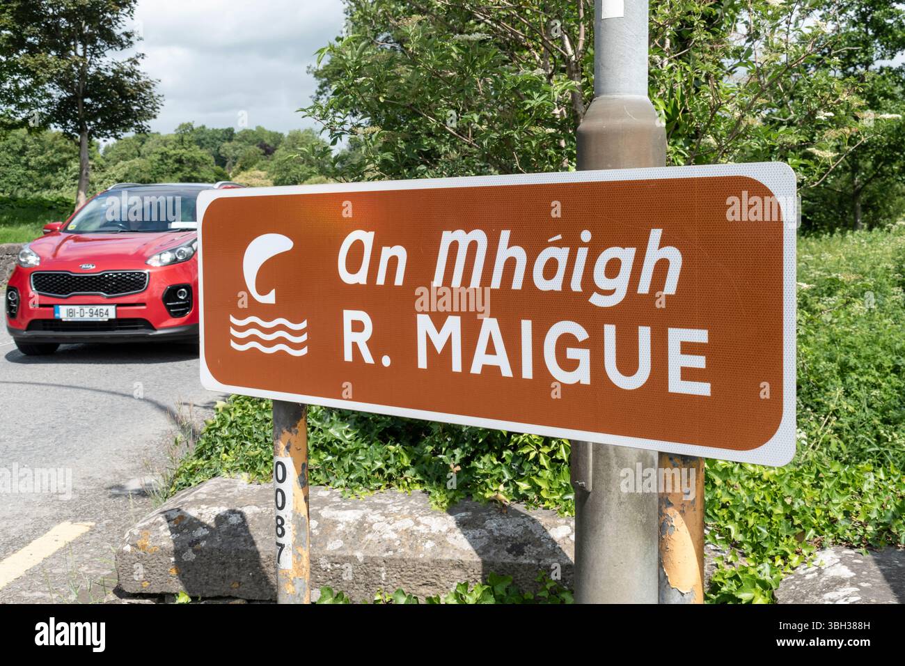 Road Sign for River Maigue (An Mháigh) with passing Car. An Mháigh ...