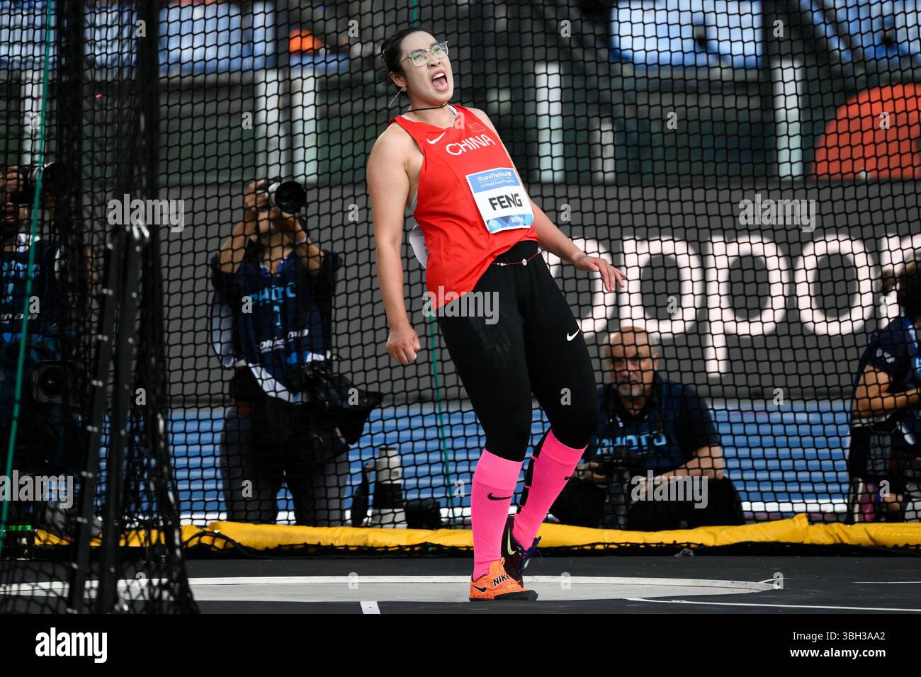Feng Bin of China reacts as she competes in the discus throw women ...