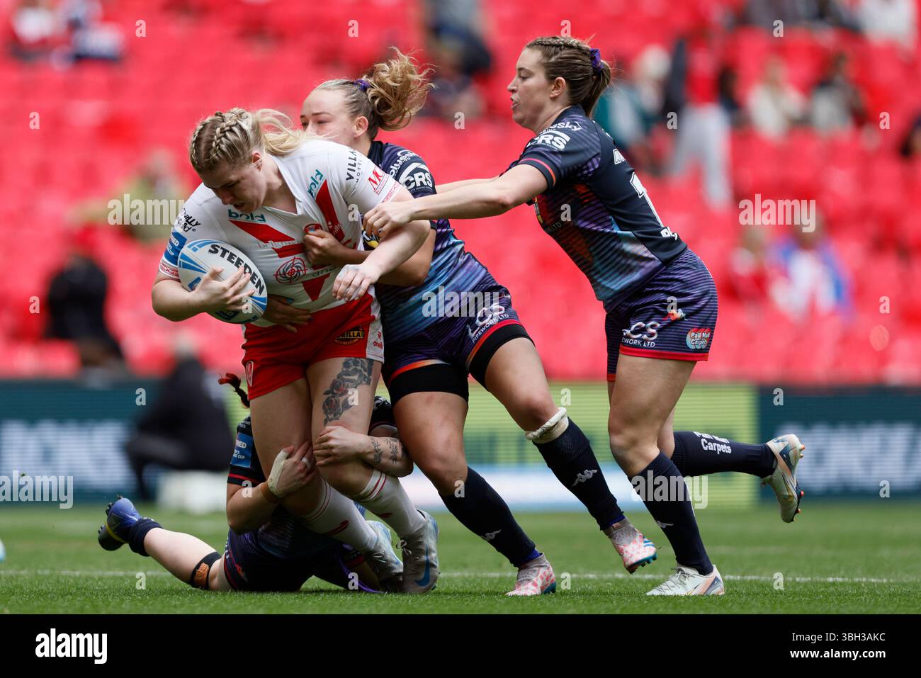St Helens' Vicky Whitfield (left) in action with the ball during the ...
