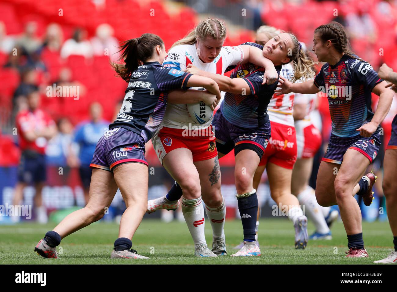 St Helens' Vicky Whitfield (centre) in action with the ball during the ...