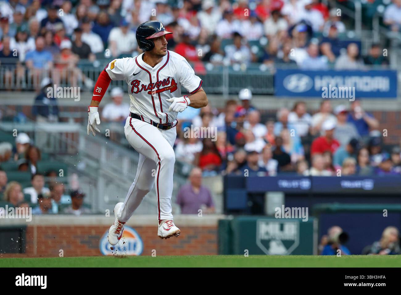 Matt Olson #28 of the Atlanta Braves runs up the line on a ground out ...