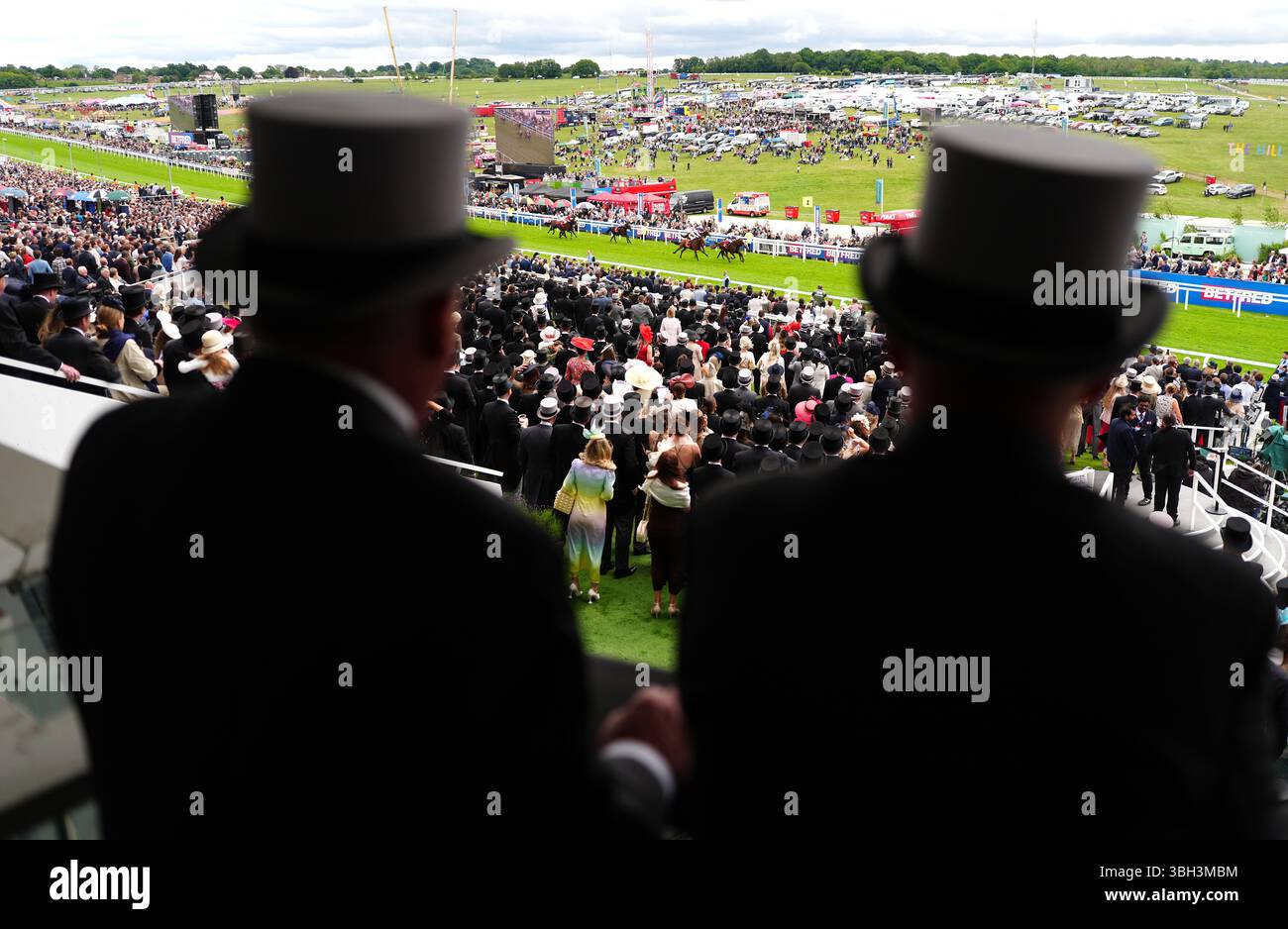 Racegoers watch on during the Betfred Diomed Stakes during Derby Day of ...
