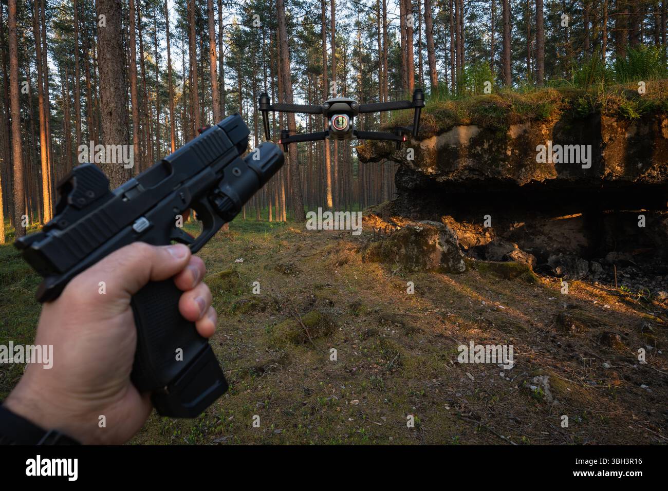 Tactical pistol in hand, first-person view: aiming at a drone near an ...