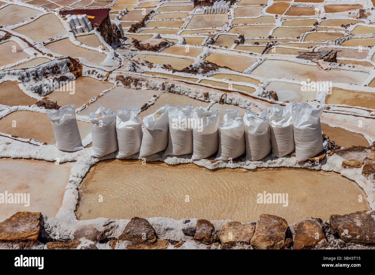 Bags of salt at Maras salt mines in the Sacred Valley of Incas, Peru ...