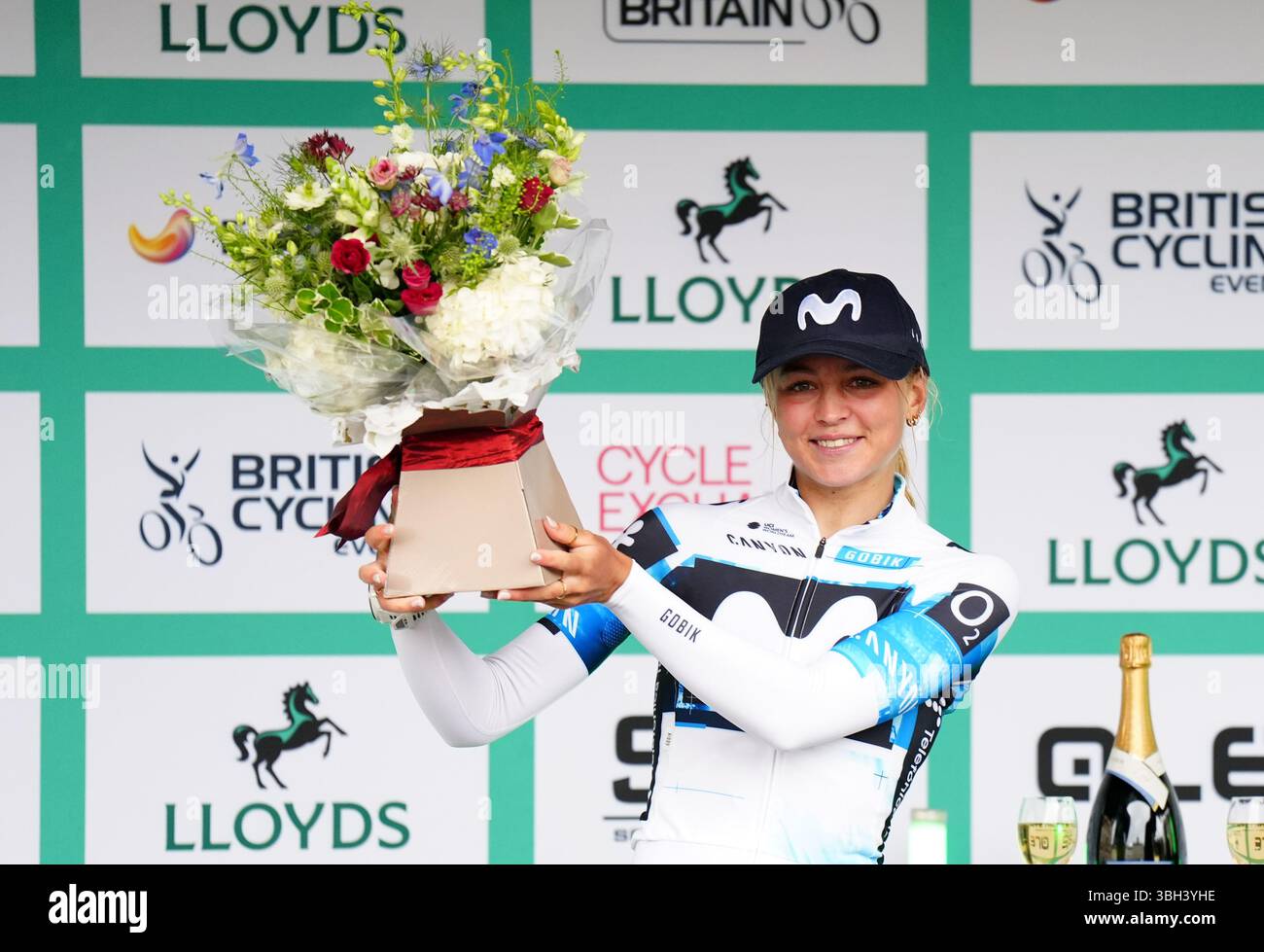 Cat Ferguson of Movistar Team celebrates on the podium after winning ...
