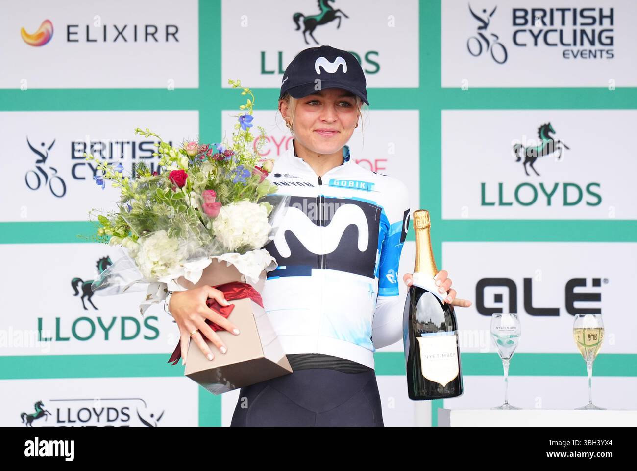 Cat Ferguson of Movistar Team celebrates on the podium after winning ...