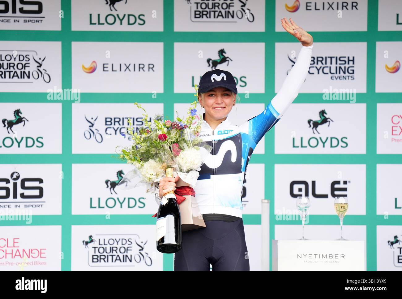 Cat Ferguson of Movistar Team celebrates on the podium after winning ...