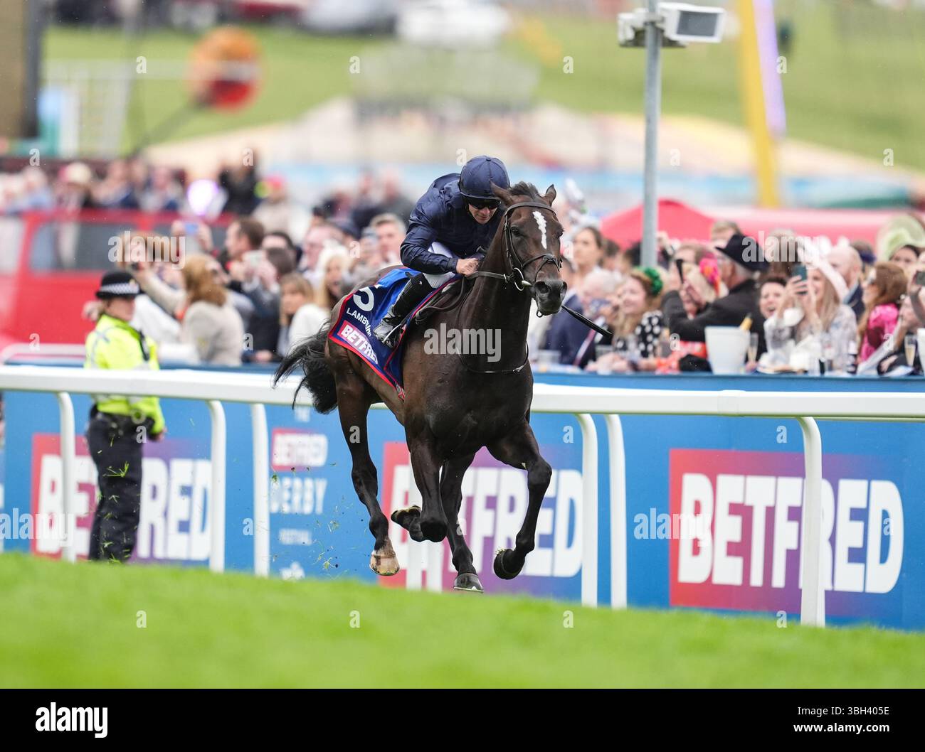 Lambourn ridden by Wayne Lordan wins the Betfred Derby during Derby Day ...