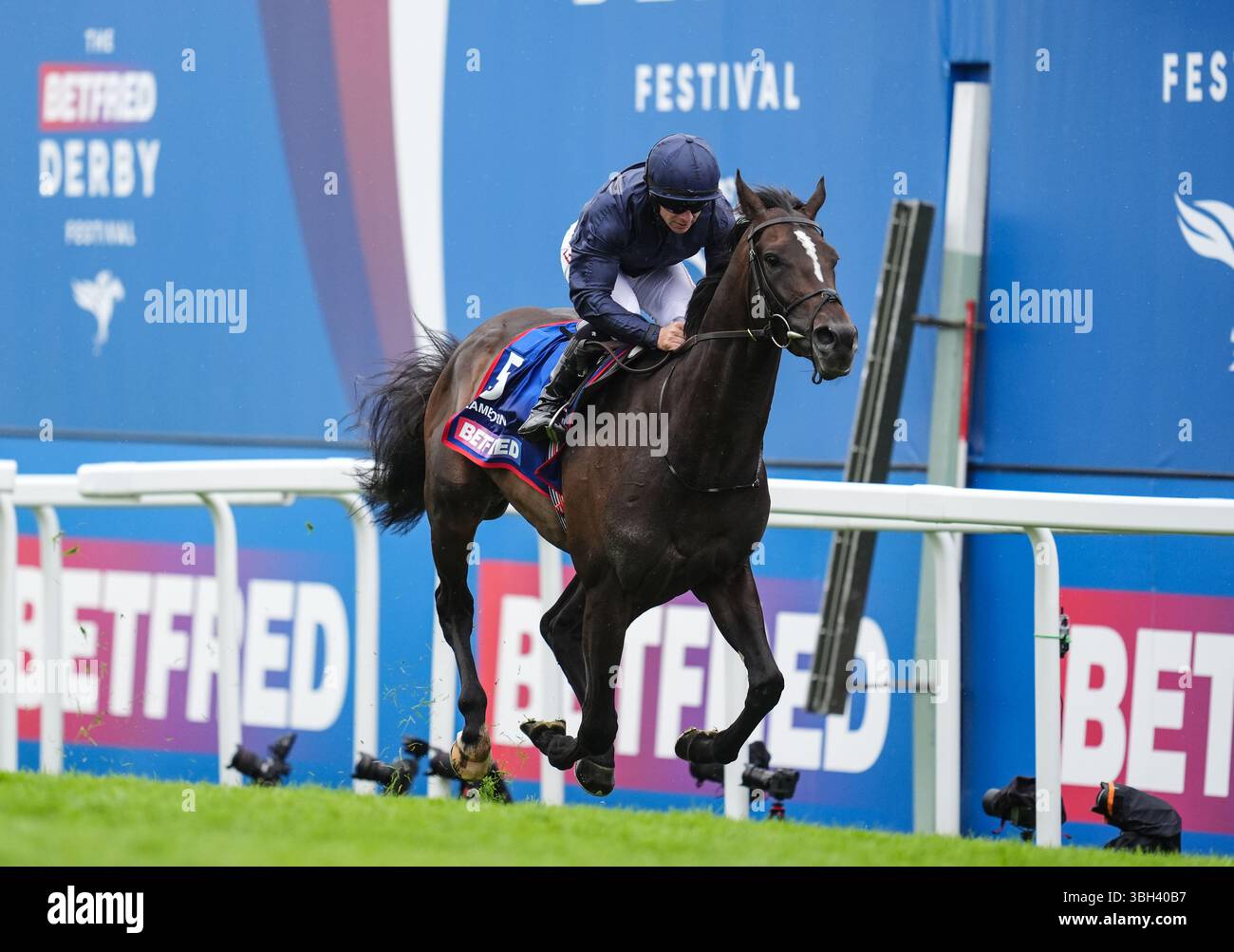 Lambourn ridden by Wayne Lordan wins the Betfred Derby during Derby Day ...