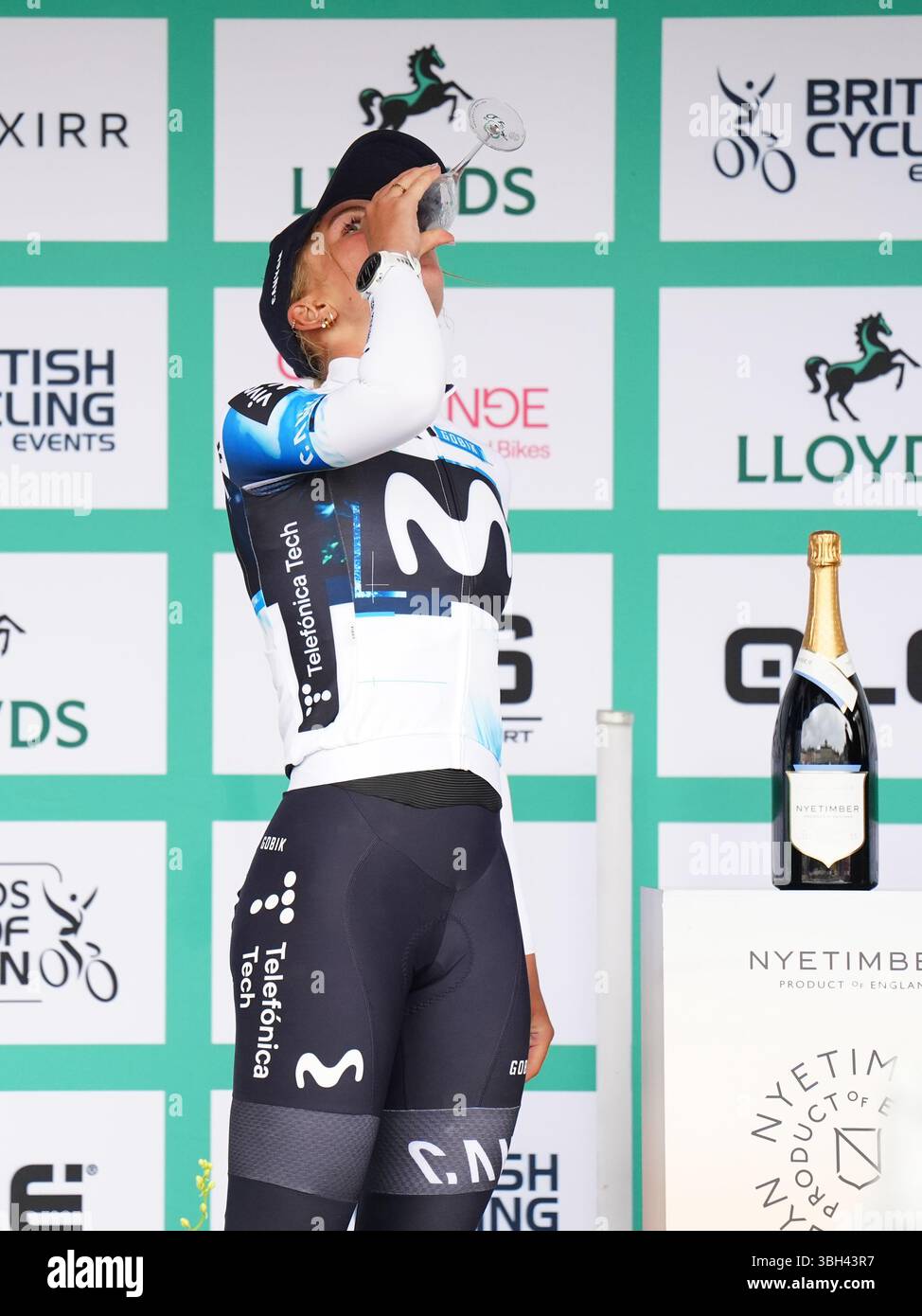 Cat Ferguson of Movistar Team celebrates on the podium after winning ...