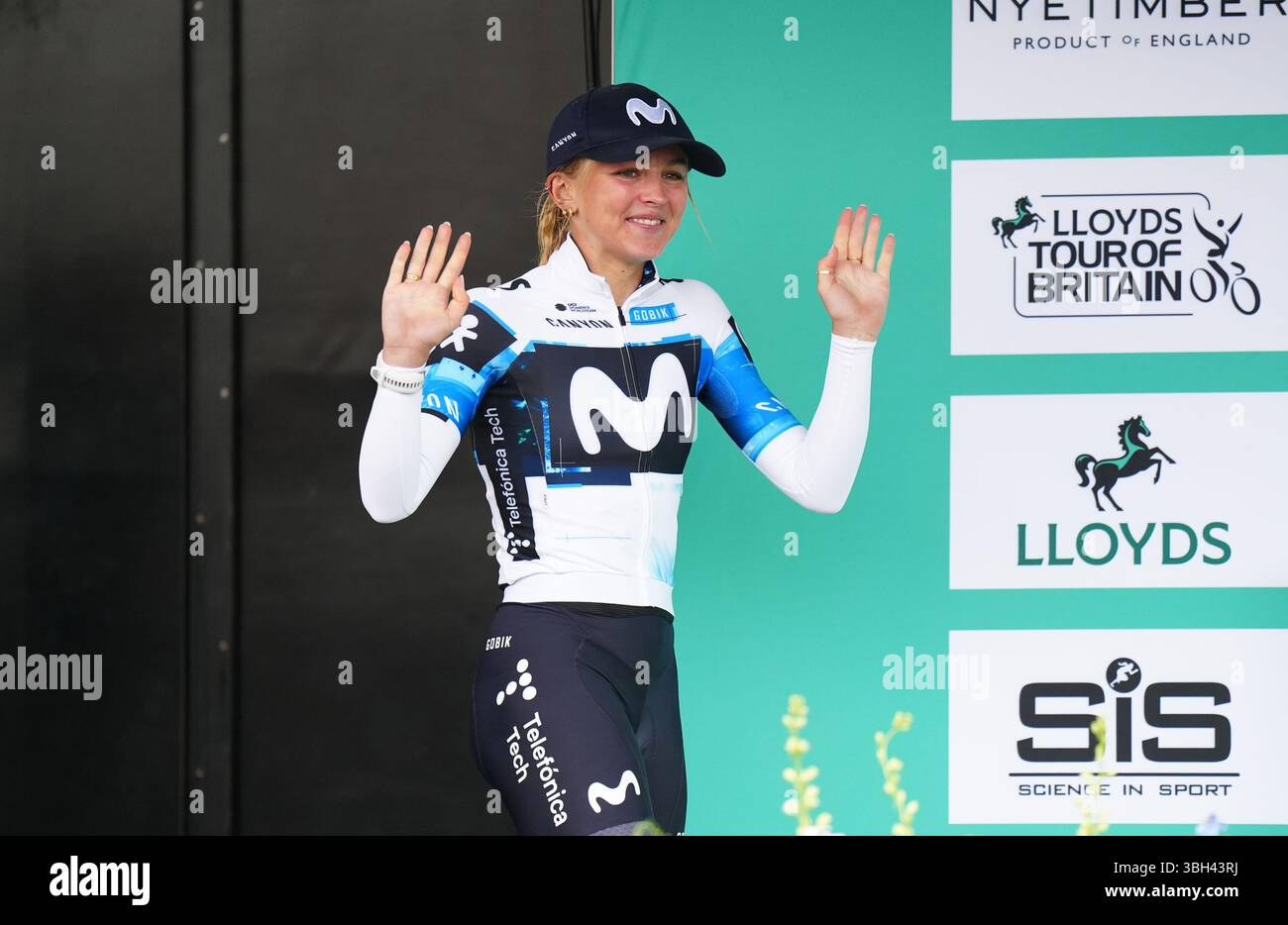 Cat Ferguson of Movistar Team celebrates on the podium after winning ...