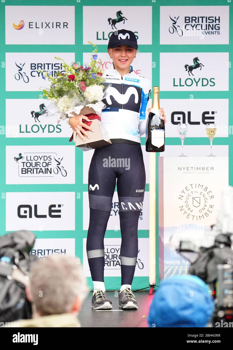 Cat Ferguson of Movistar Team celebrates on the podium after winning ...