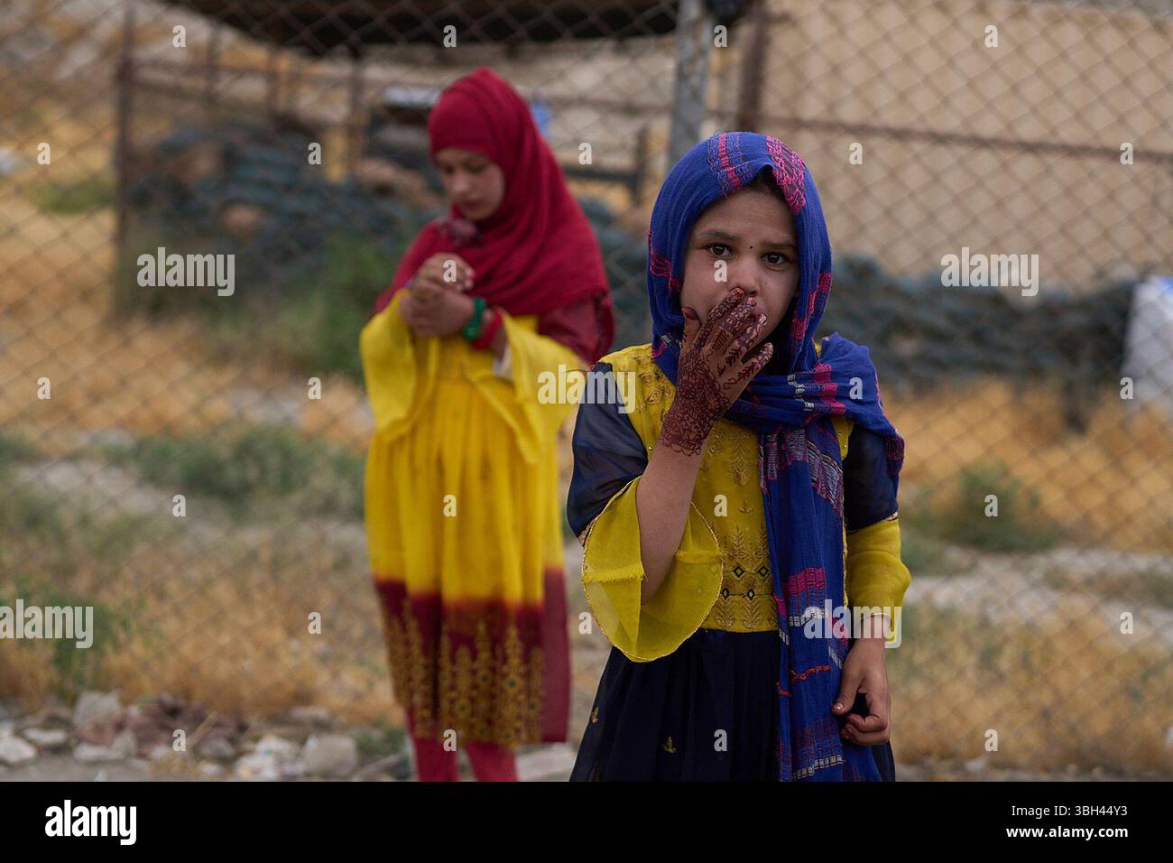 Girls stand on a playground during Eid al-Adha in Kabul, Afghanistan ...
