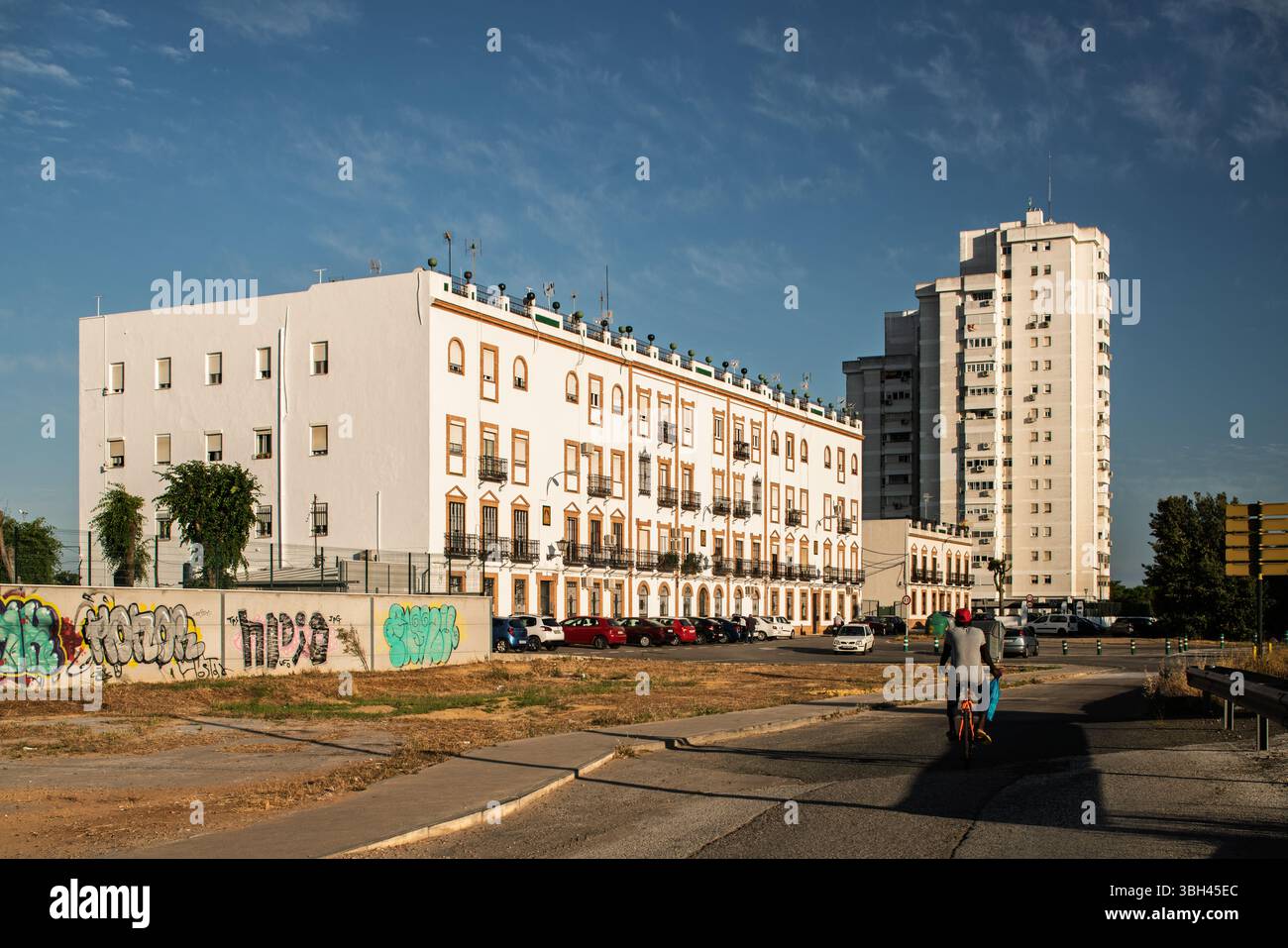 Mid-20th-century buildings alongside a taller structure in Seville's ...