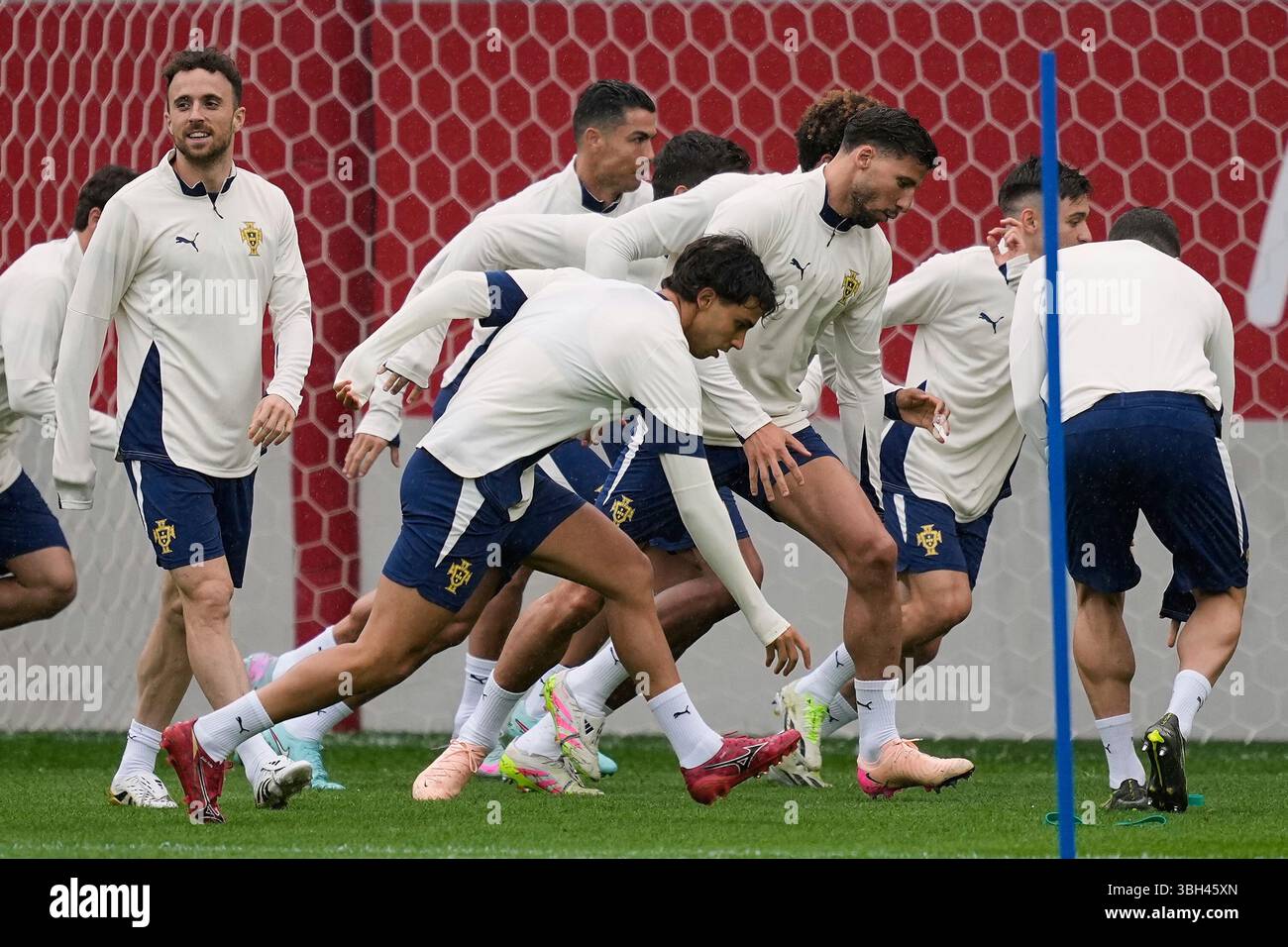 Portugal's Cristiano Ronaldo, center, exercises with his team during a ...