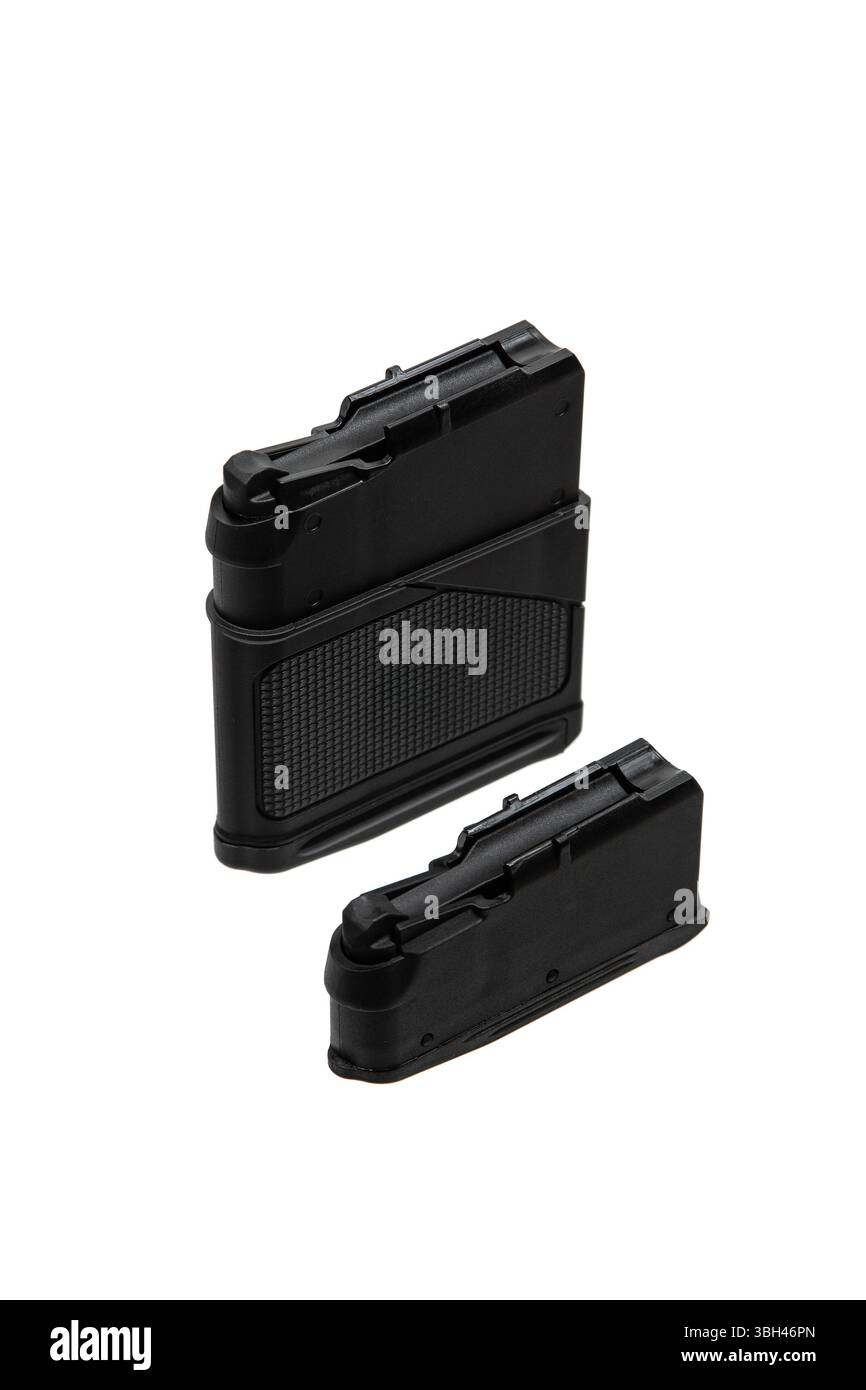 Two black rifle magazines of different sizes on a white background ...
