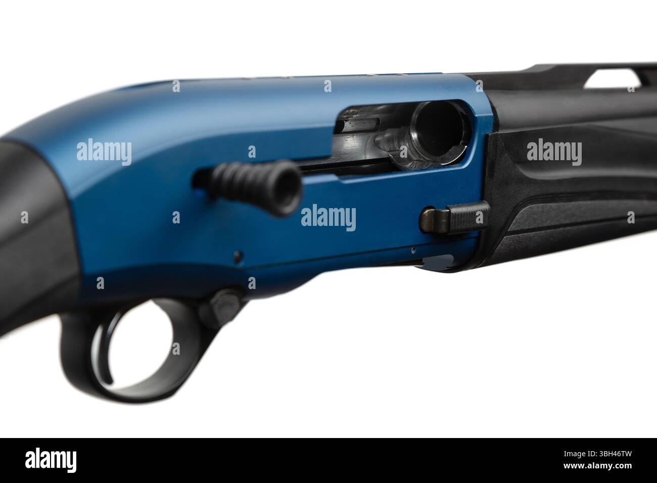 Close-up of semi-automatic shotgun bolt and ejection port, blue ...