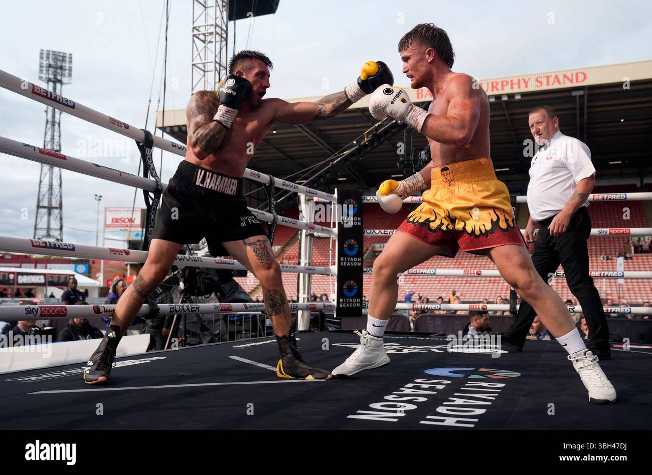 Harley Collison (left) in action against Red Johnson (right) at Oakwell ...