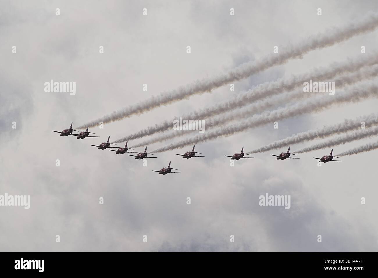 The Red Arrows flying in formation before landing at Liverpool John ...