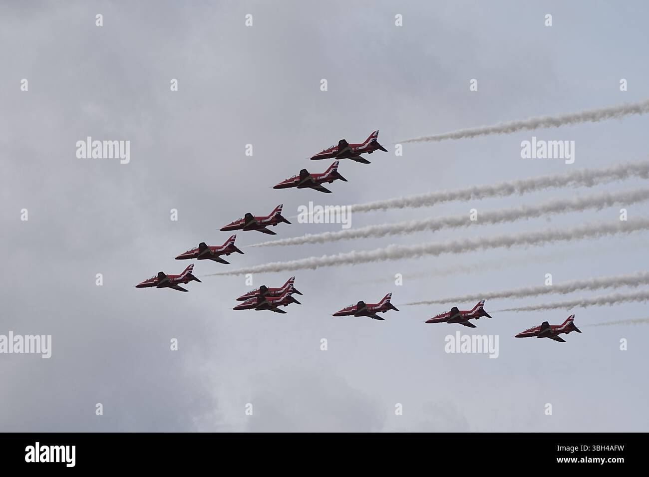 The Red Arrows flying in formation before landing at Liverpool John ...