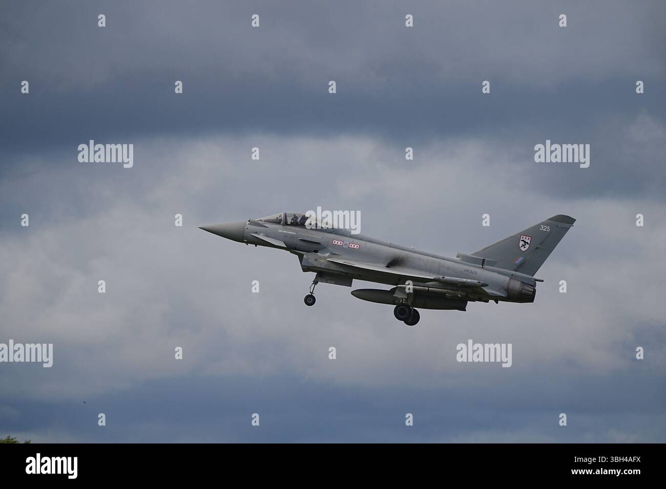 A RAF Typhoon follows the Red Arrows into Liverpool John Lennon Airport ...
