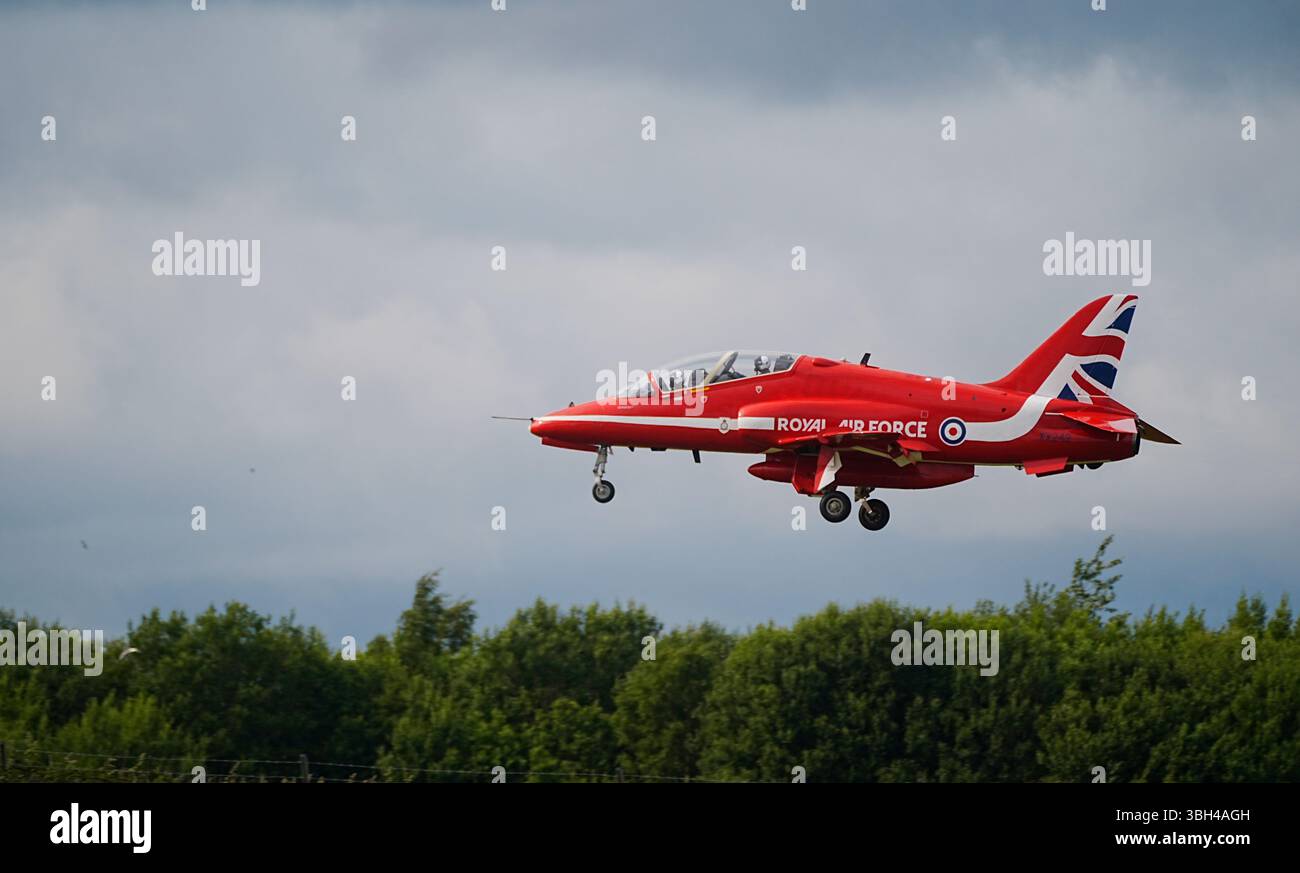 One of the Red Arrows Hawk T1 jets comes in to land at Liverpool John ...