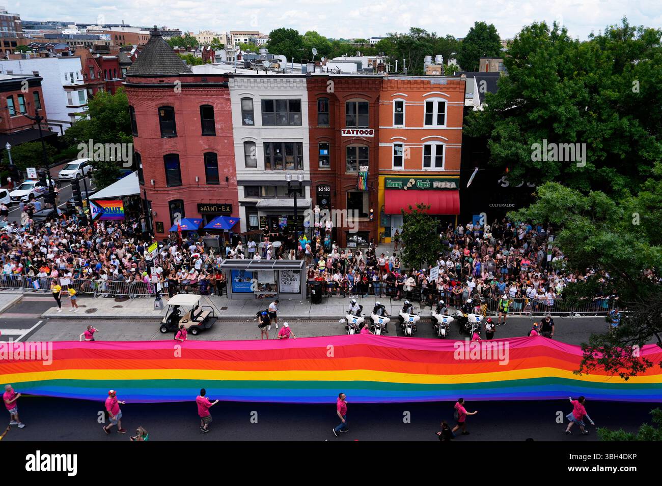 People carry a large pride flag during the World Pride parade, Saturday ...