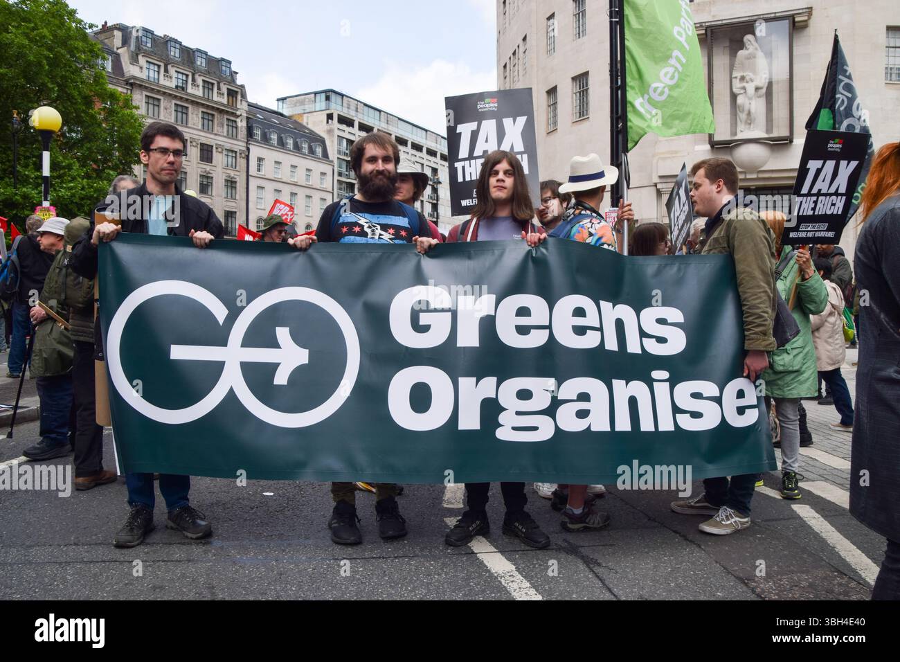 London, UK. 07th June, 2025. Protesters hold a 'Greens Organise' banner ...