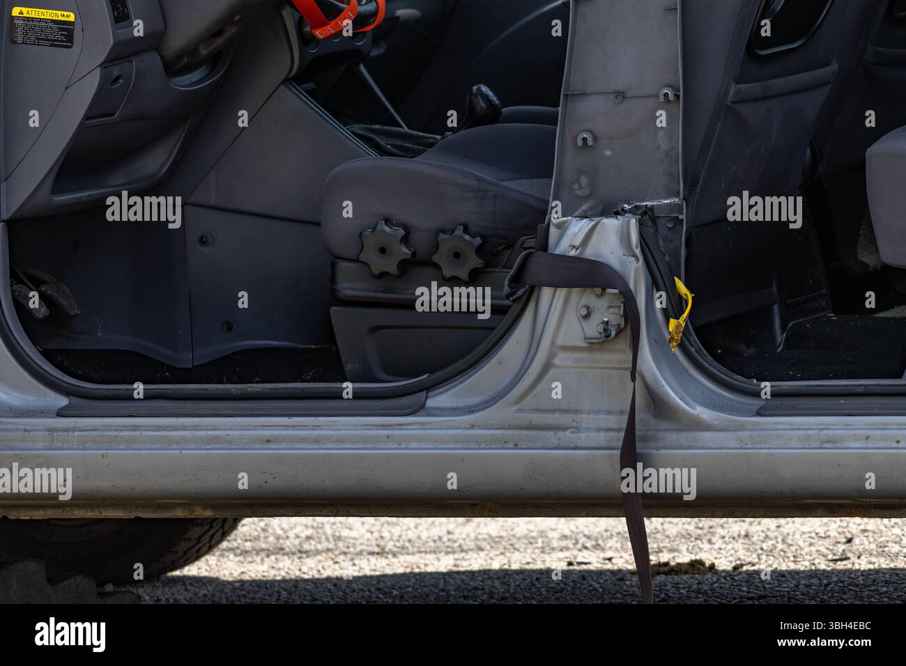 A cut-out center pillar in the car body, pulling injured passengers out ...