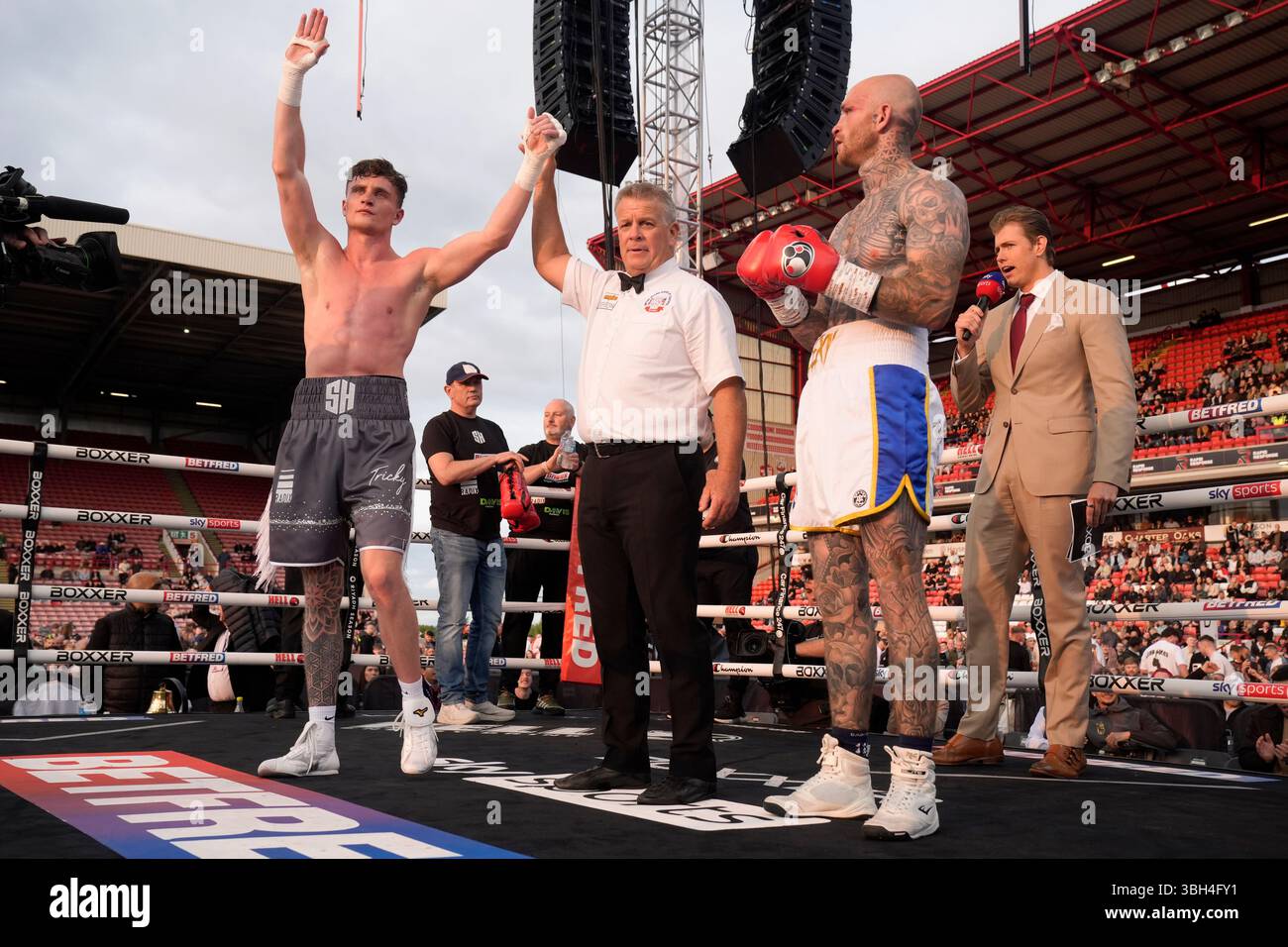 Sam Hickey (left) celebrates winning his fight against Harley Hodgetts ...