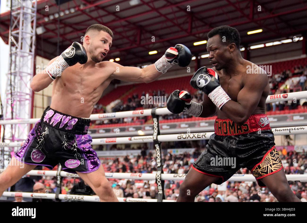 Rhys Edwards (left) in action against Thomas Essomba (right) at Oakwell ...