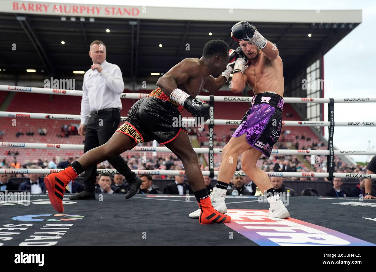 Rhys Edwards (right) in action against Thomas Essomba (left) at Oakwell ...