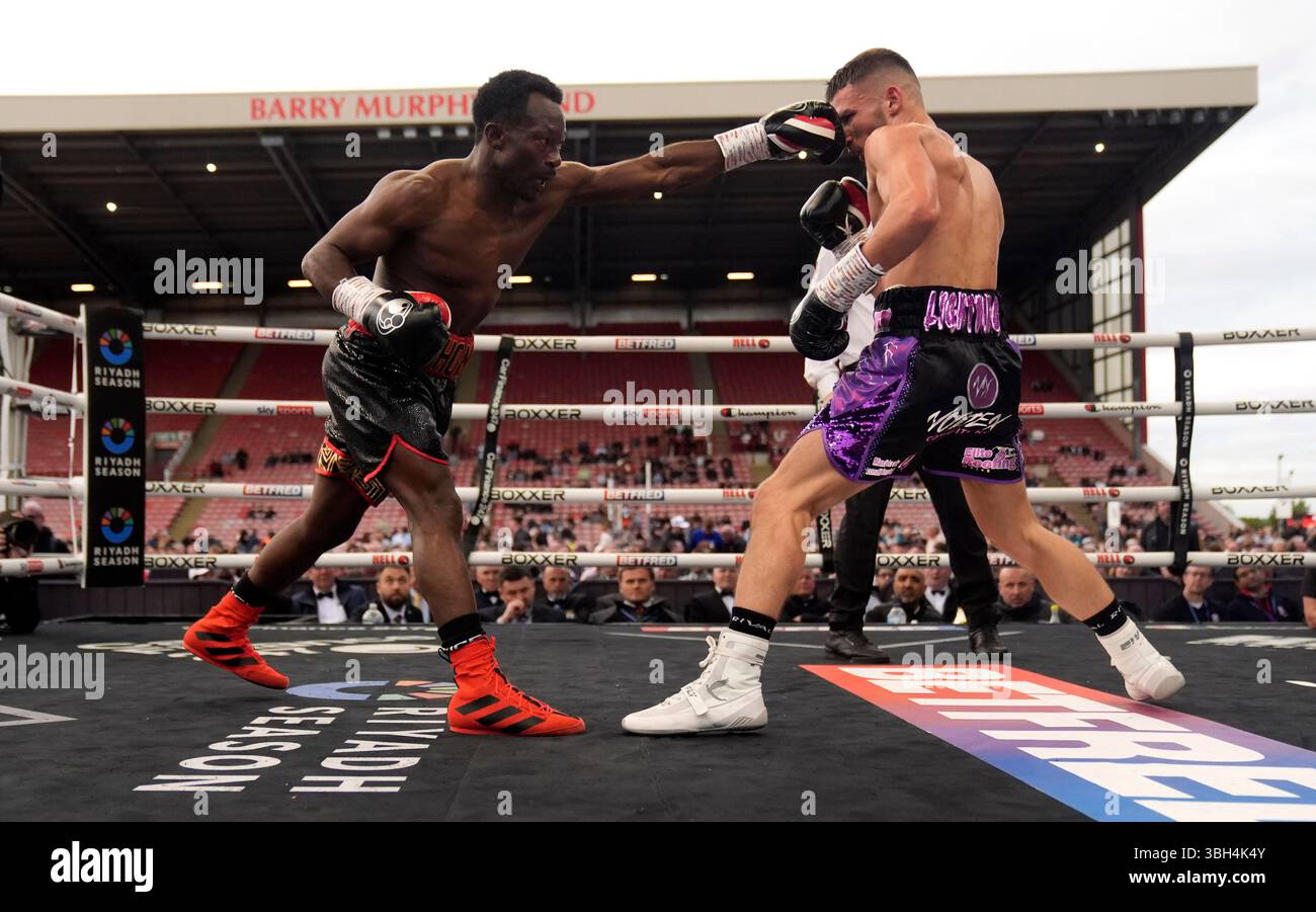 Rhys Edwards (right) in action against Thomas Essomba (left) at Oakwell ...