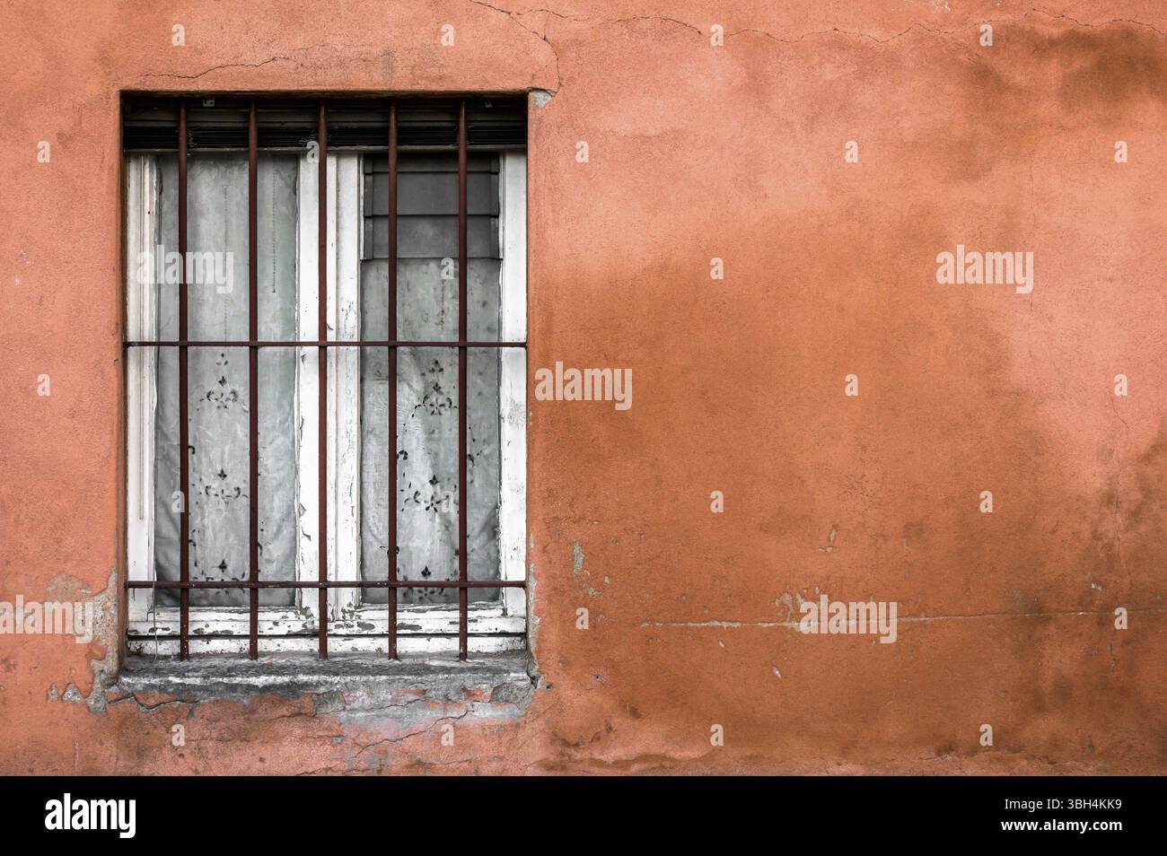 Old typical Mediterranean window on ocher stucco wall Stock Photo - Alamy