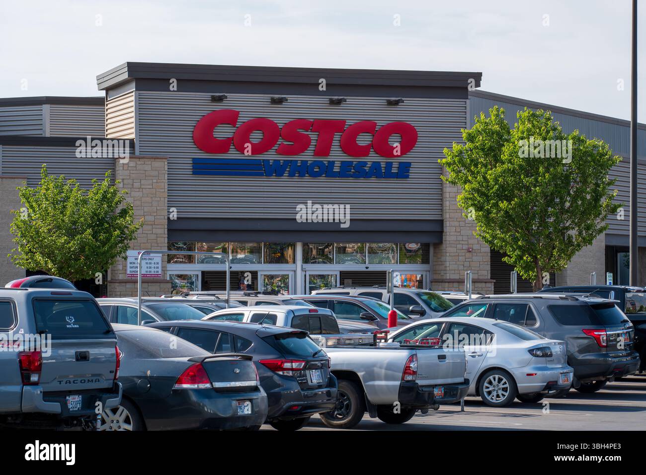 SPANISH FORK, UT – JUNE 8, 2025: Exterior of Costco Wholesale with trademark logo. Founded in ...